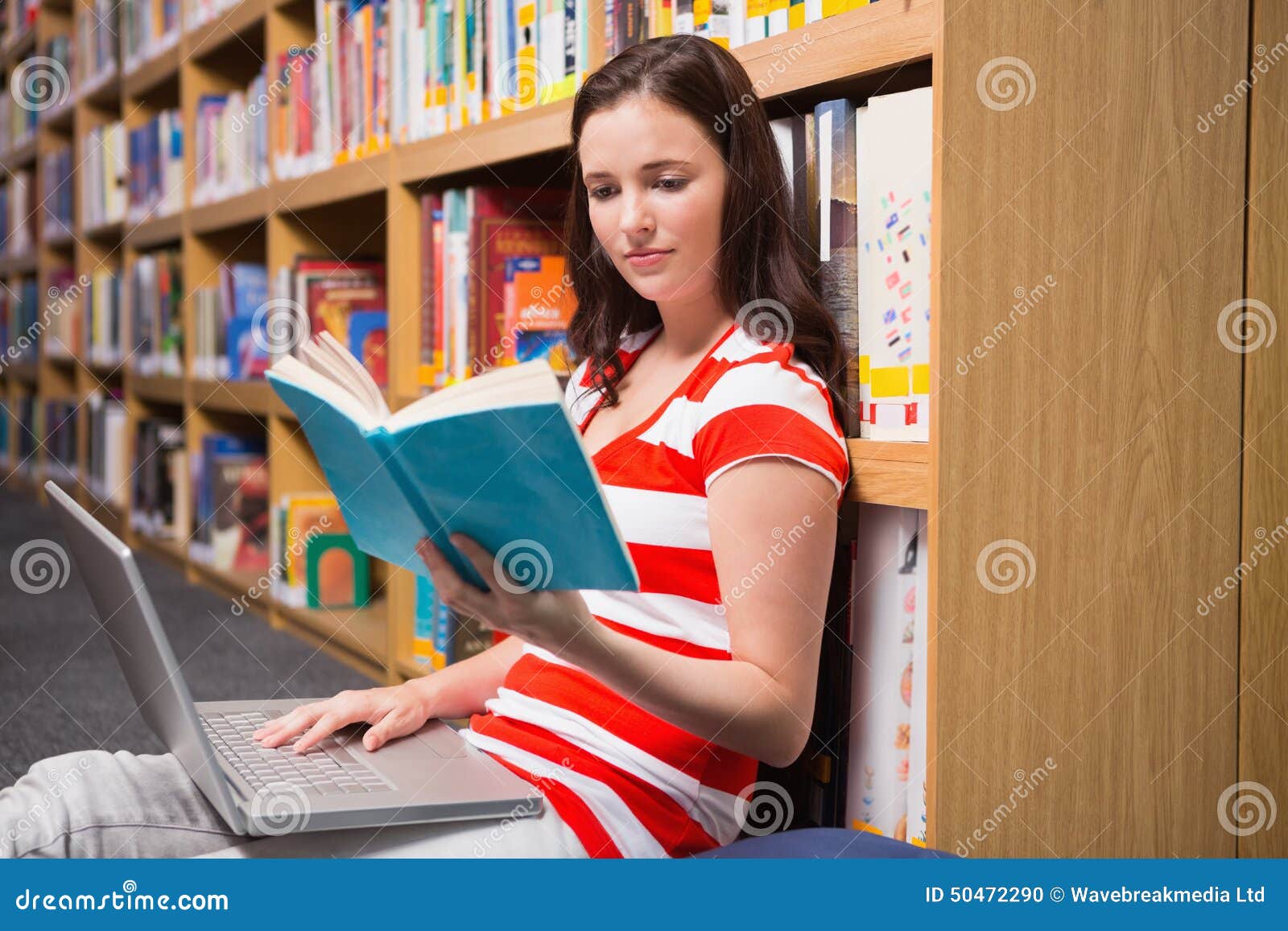 Student Sitting on Floor in Library Reading Stock Photo - Image of ...