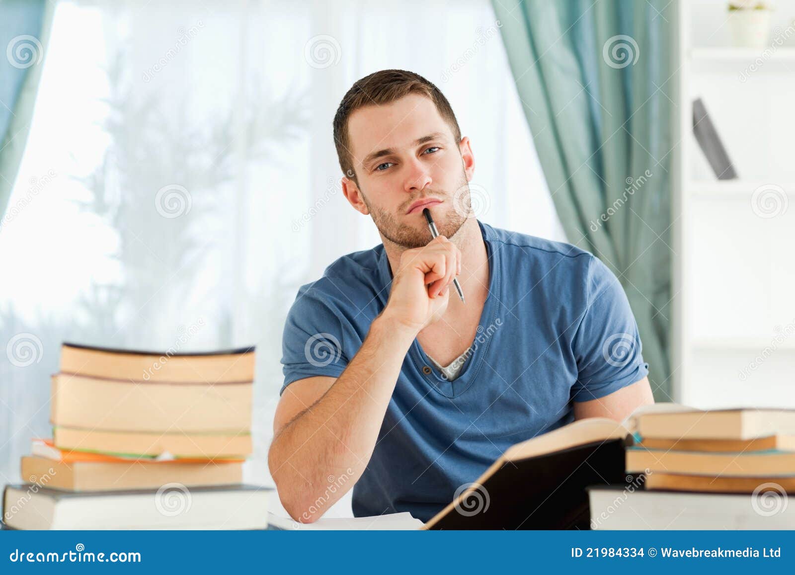 Student Sitting at His Desk Doing His Homework Stock Photo - Image of ...