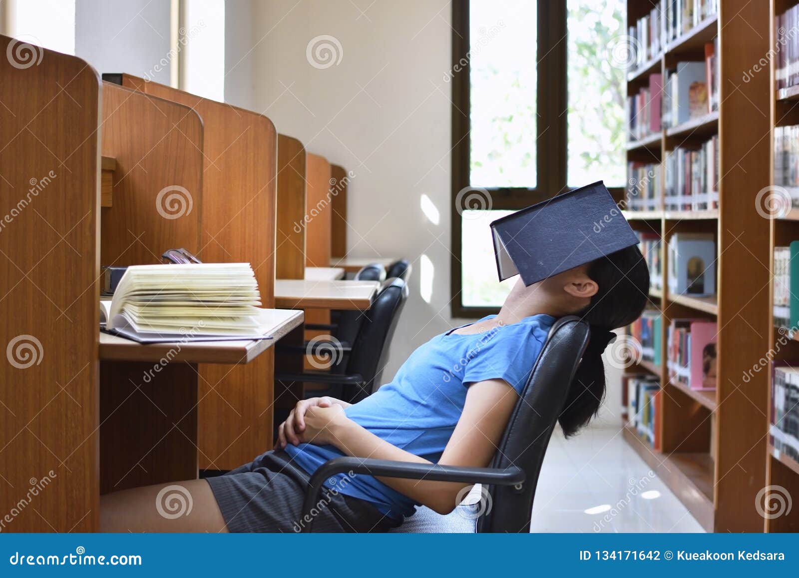 Student Sleeping with Book in the Library Stock Photo - Image of ...