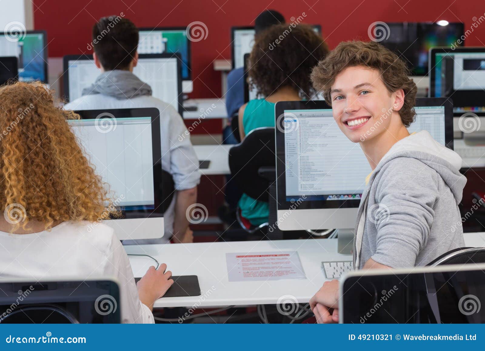Student Smiling at Camera in Computer Class Stock Image - Image of ...