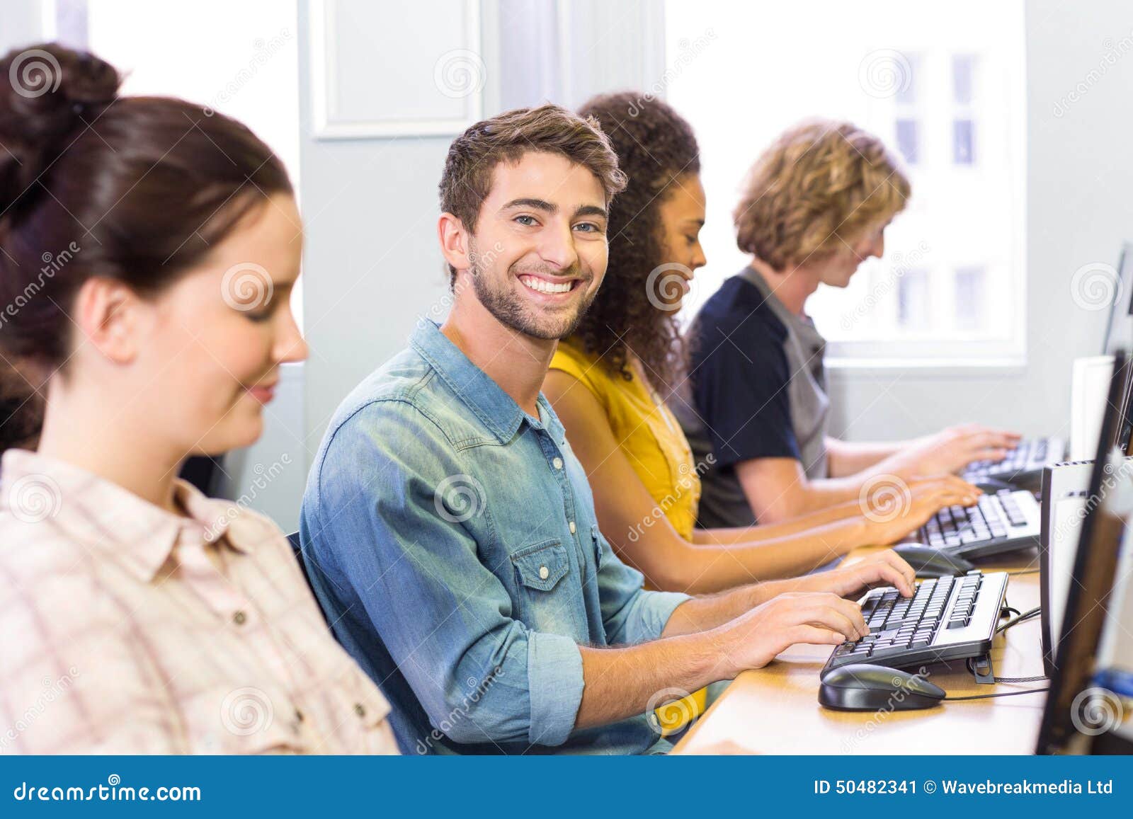 Student Smiling at Camera in Computer Class Stock Image - Image of ...