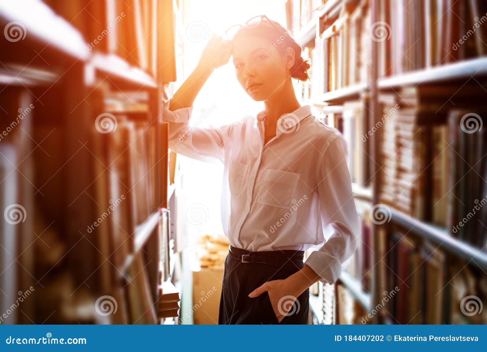 Student Stands between the Rows in the Library, Stock Photo - Image of ...