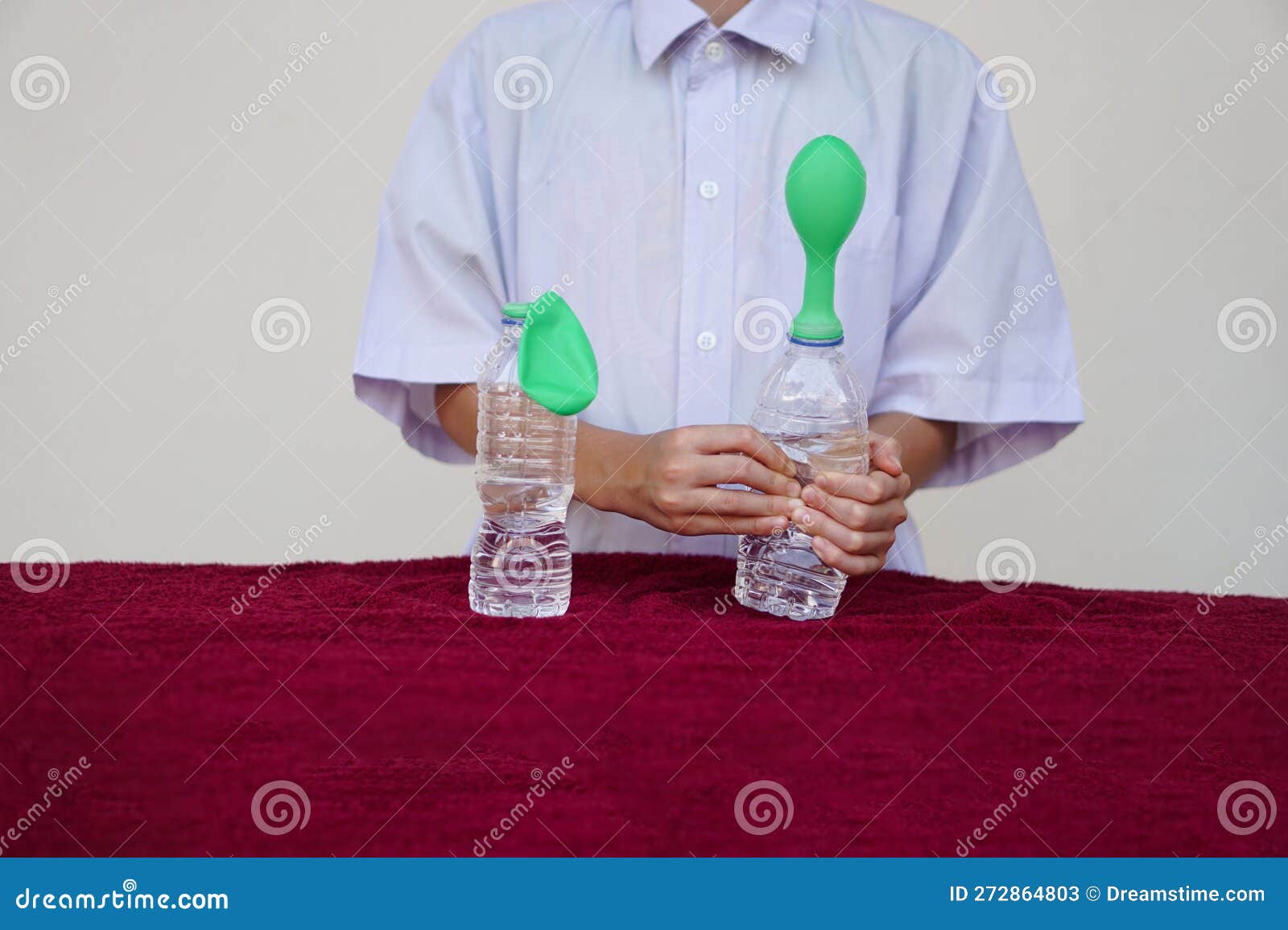 Student Study Science Experiment, Hold Two Bottles with Green Balloons ...