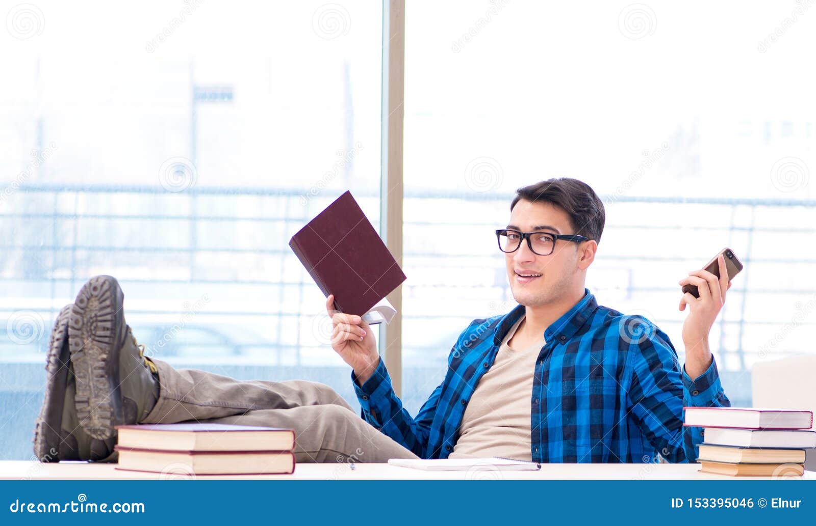 Student Studying in the Empty Library with Book Preparing for Ex Stock ...