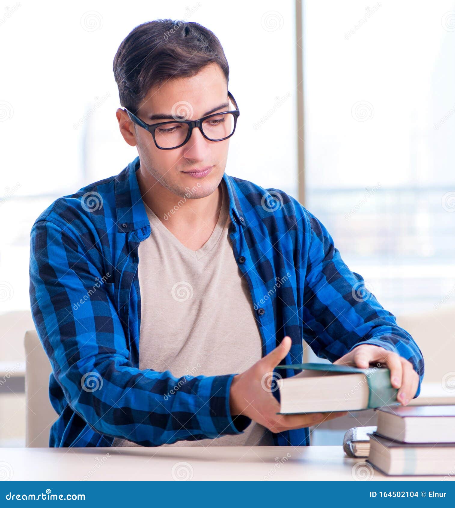 Student Studying in the Empty Library with Book Preparing for Ex Stock ...