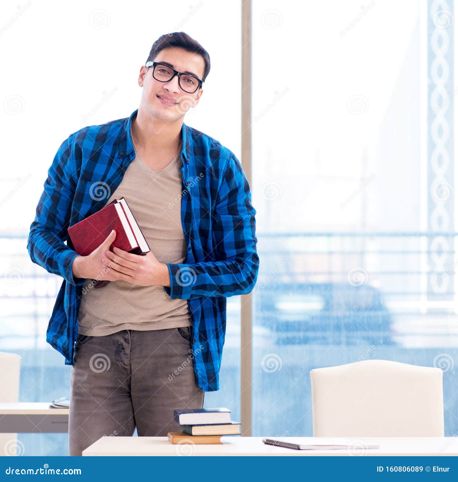 Student Studying in the Empty Library with Book Preparing for Ex Stock ...