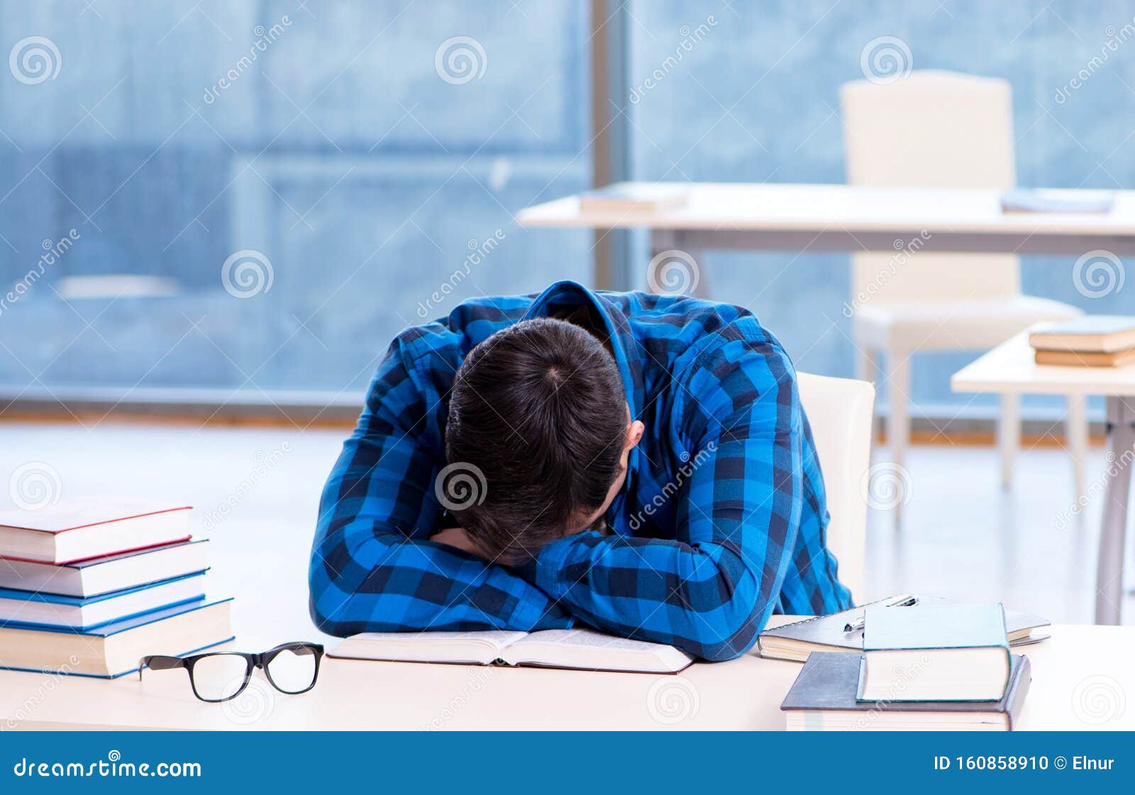 Student Studying in the Empty Library with Book Preparing for Ex Stock ...