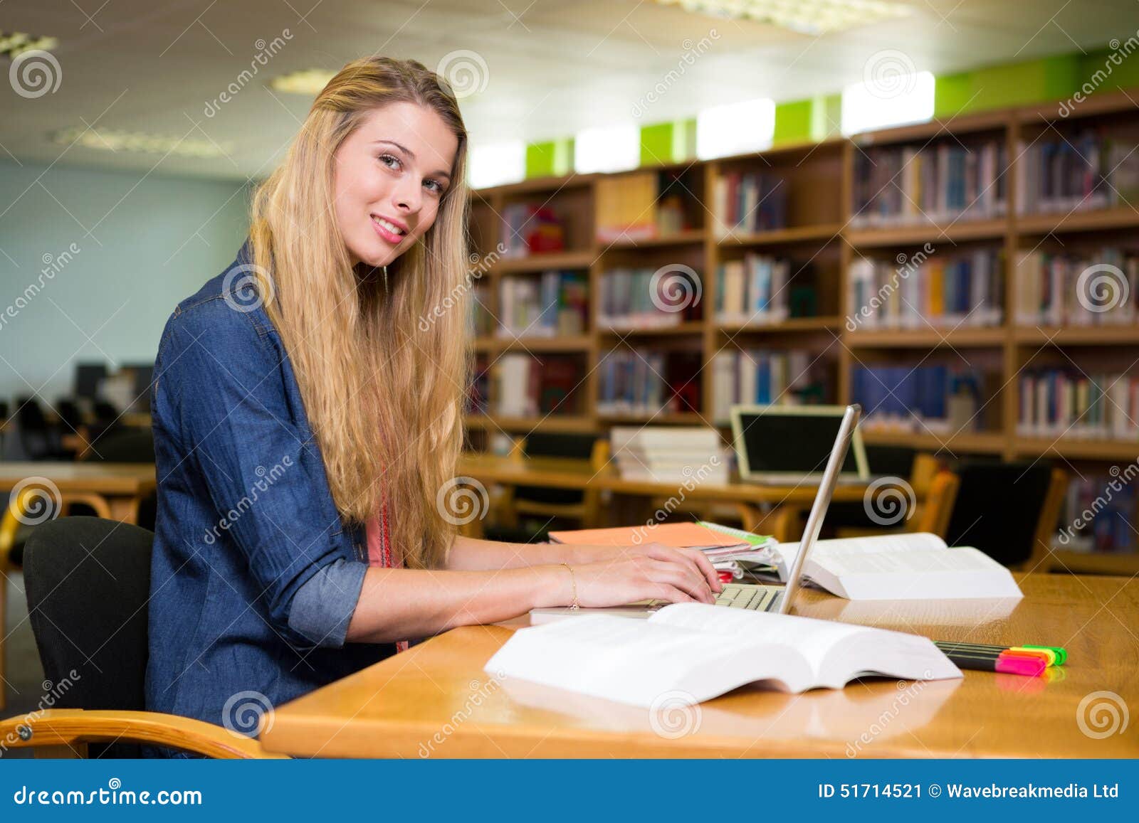 Student Studying in the Library with Laptop Stock Image - Image of ...
