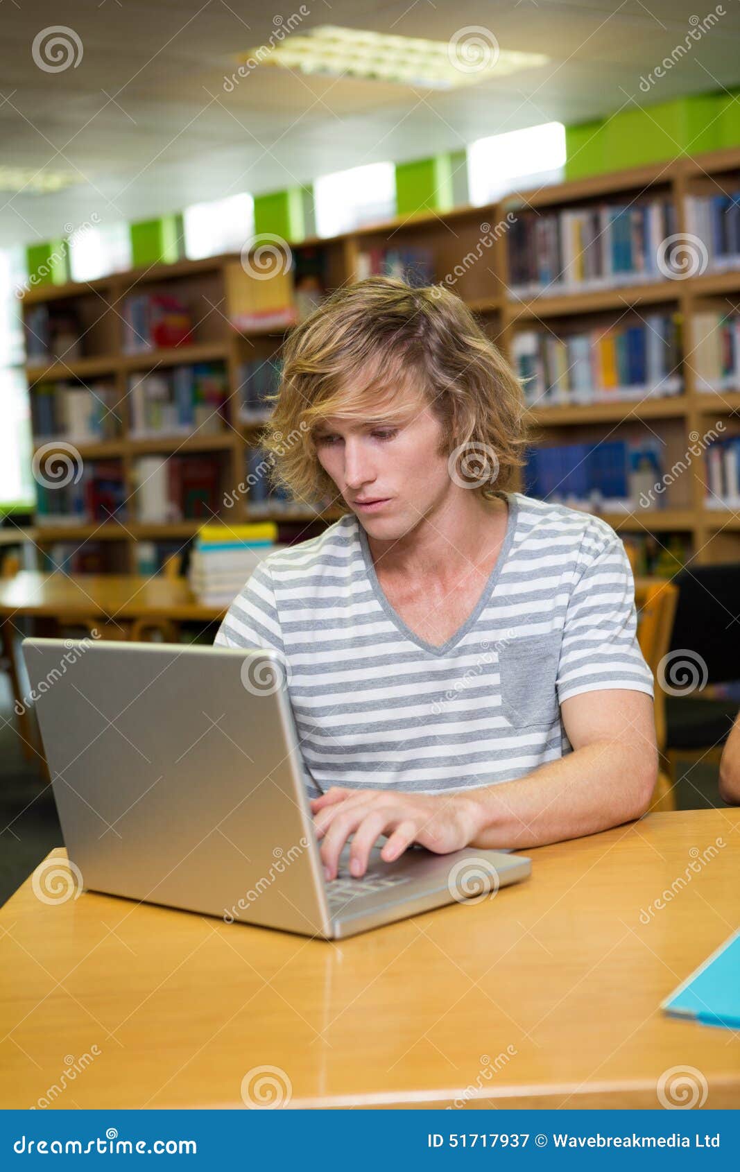 Student Studying in the Library with Laptop Stock Image - Image of ...