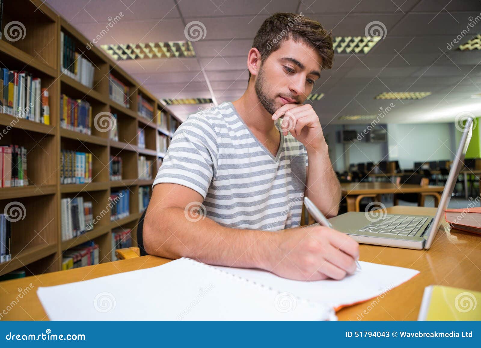 Student Studying in the Library with Laptop Stock Image - Image of ...