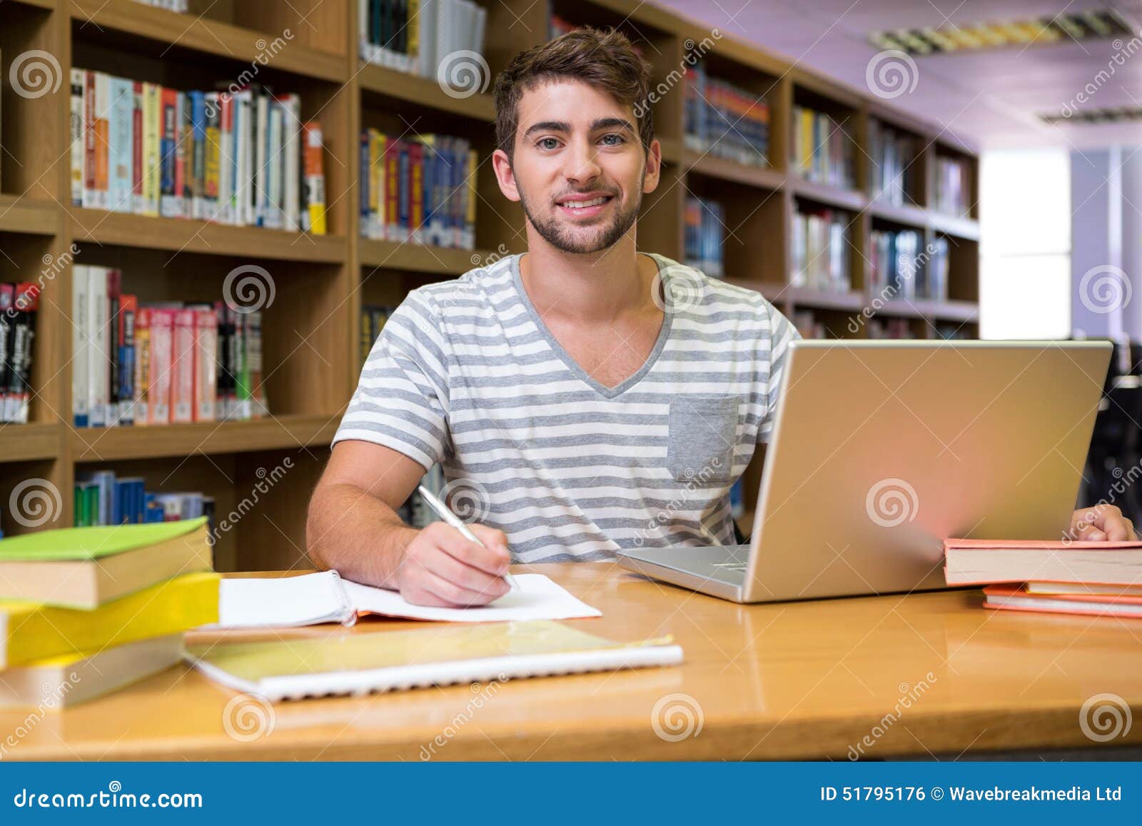 Student Studying in the Library with Laptop Stock Photo - Image of ...