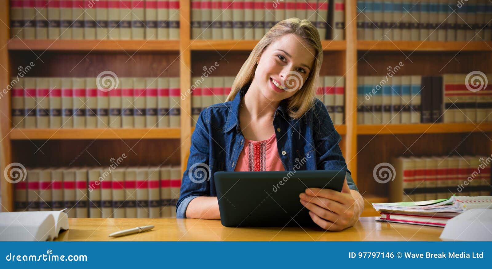 Composite Image of Student Studying in the Library with Tablet Stock ...