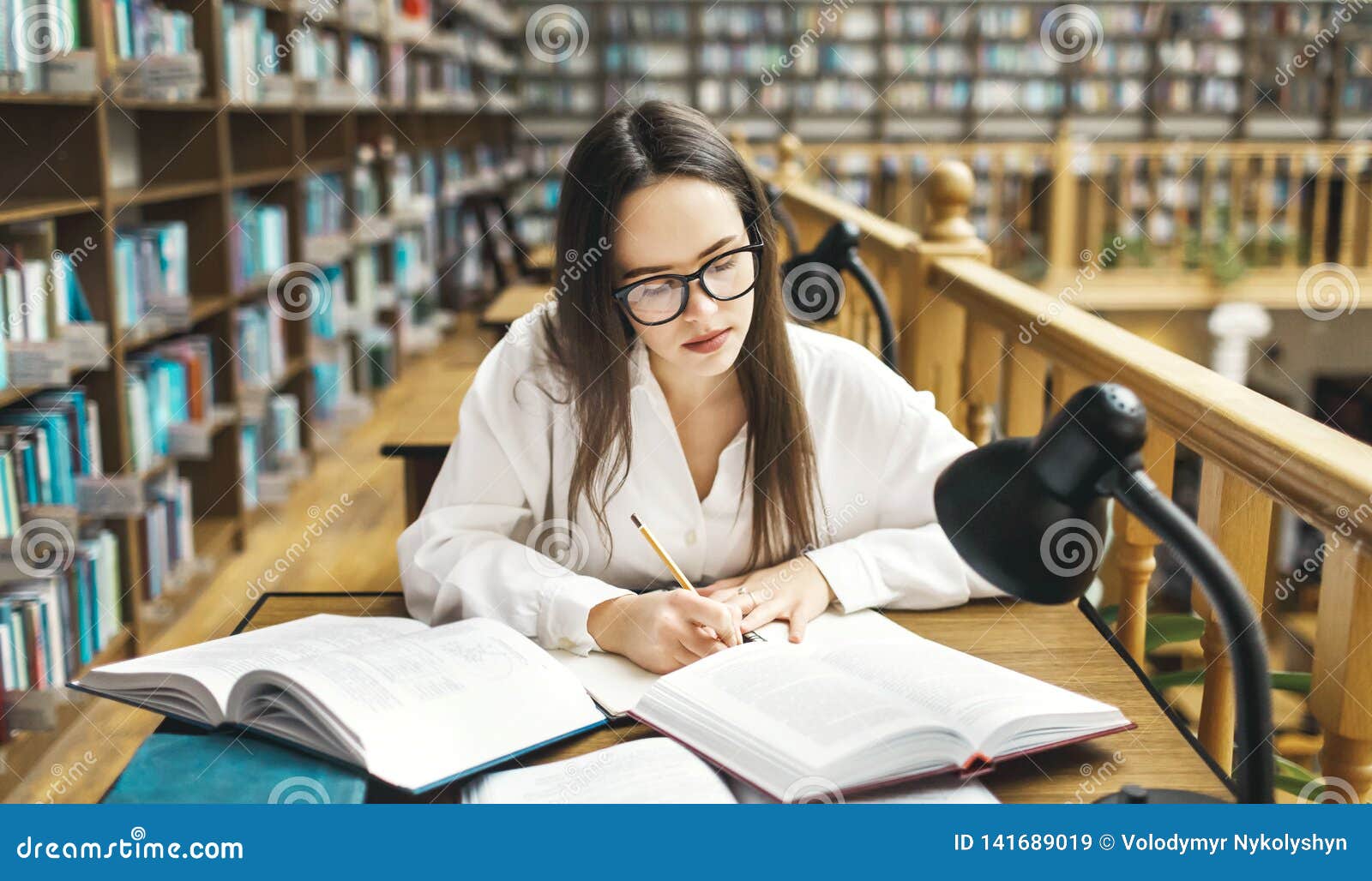 Student Studying at the Library Stock Image - Image of literature ...