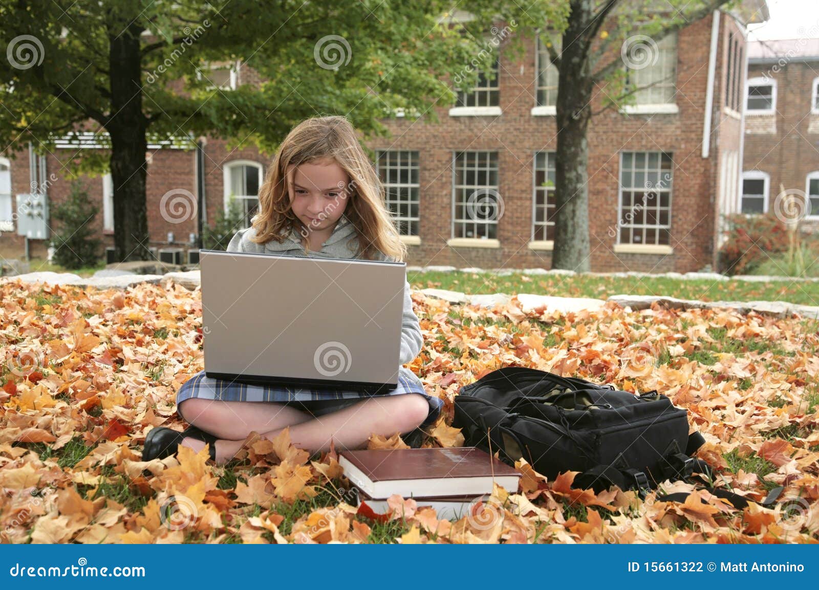Student studying outdoors stock photo. Image of book - 15661322