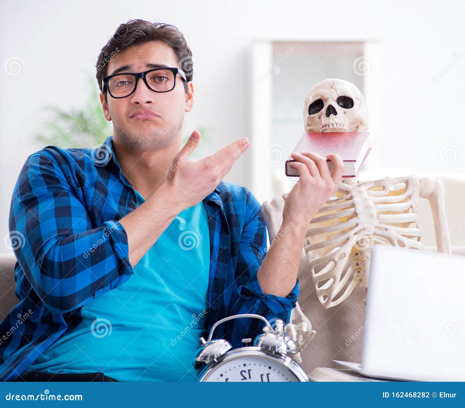 Student Studying with Skeleton Preparing for Exams Stock Photo - Image ...
