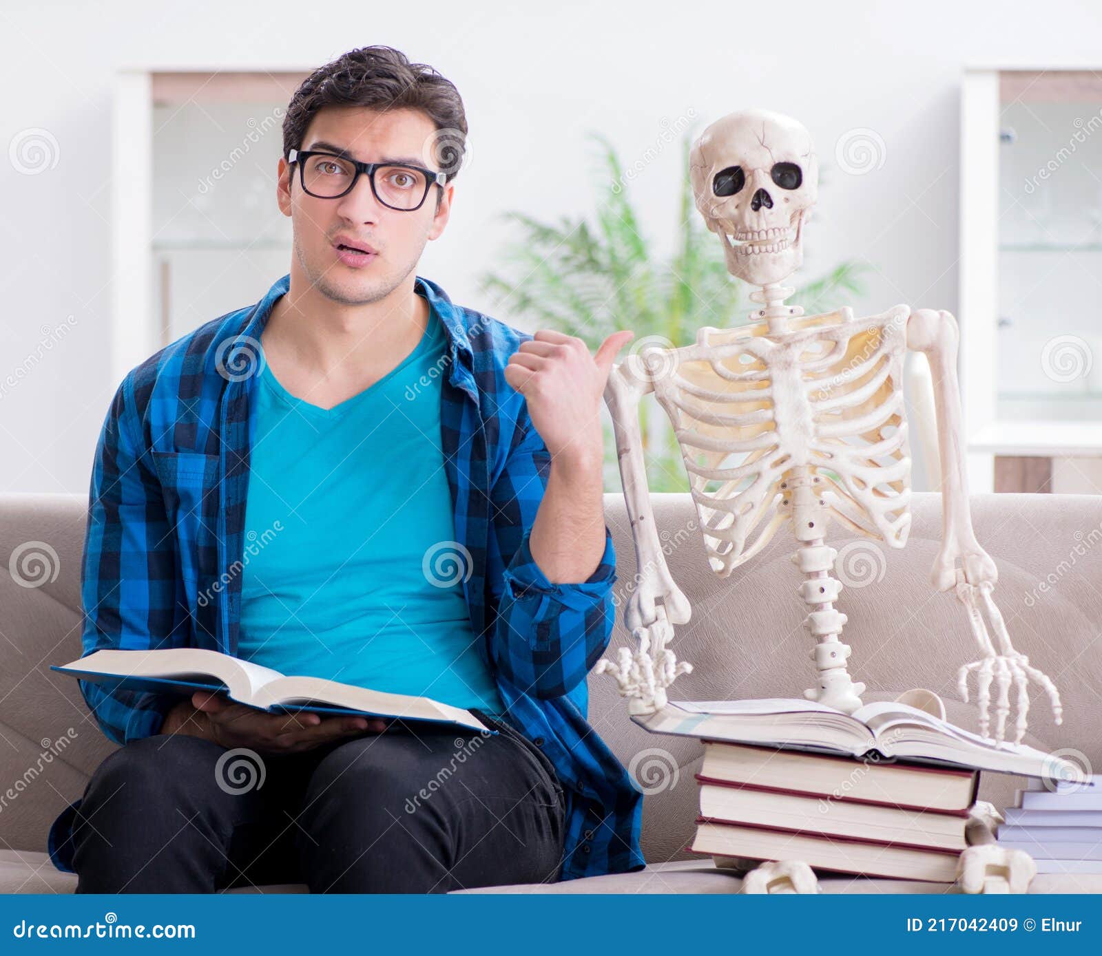 Student Studying with Skeleton Preparing for Exams Stock Image - Image ...