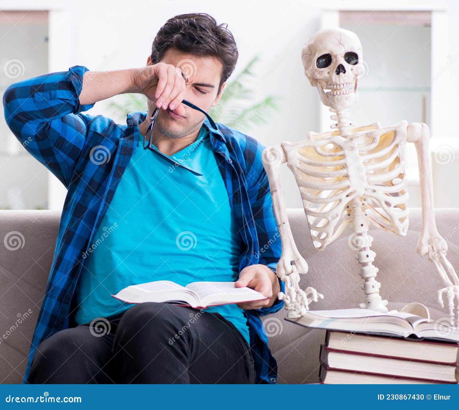 Student Studying with Skeleton Preparing for Exams Stock Photo - Image ...