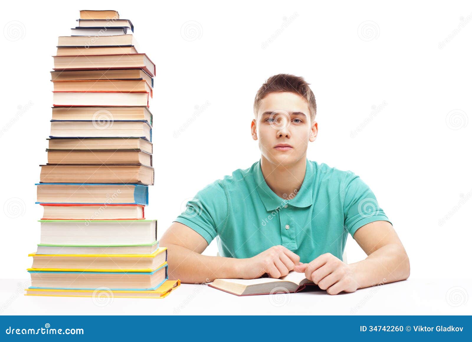 Student Studying at a Table with High Books Stack Stock Photo - Image ...