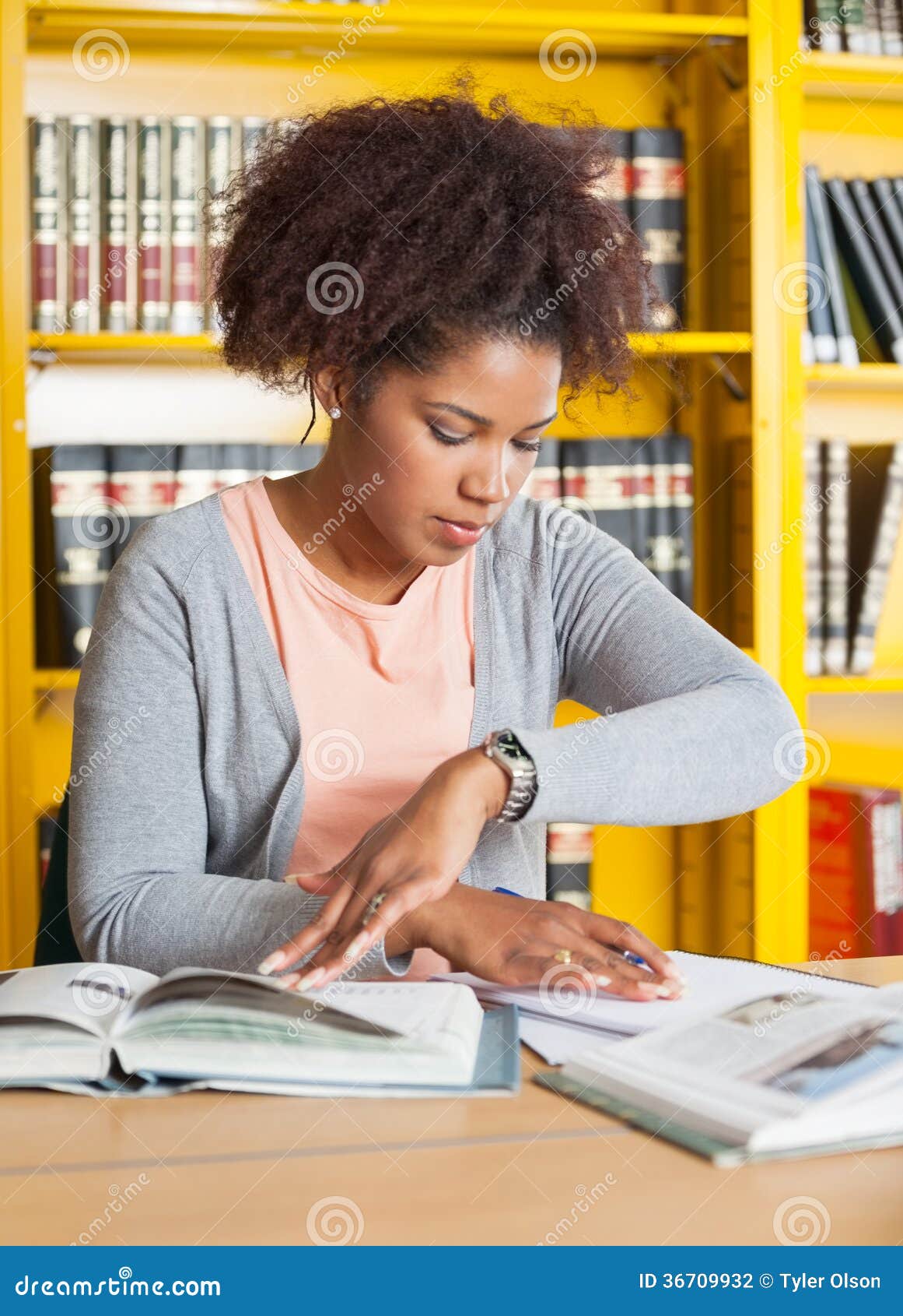 Student Studying at Table in University Library Stock Photo - Image of ...