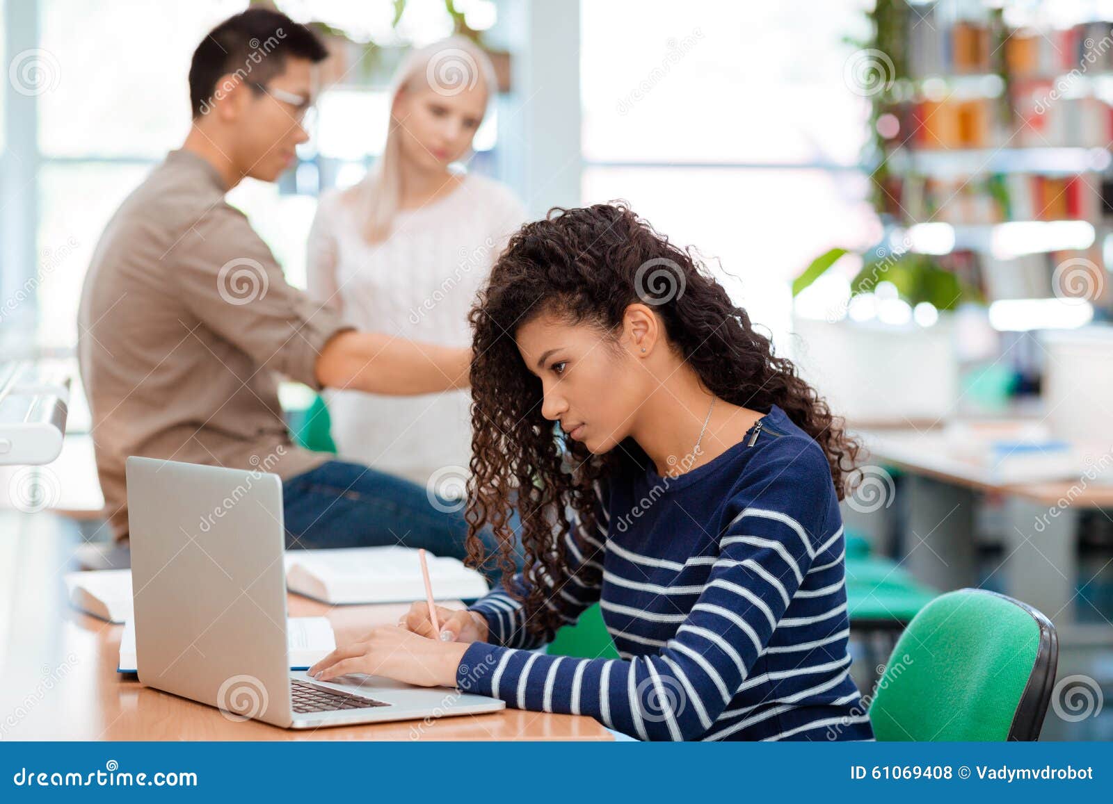 Student Studying at the Table in University Library Stock Photo - Image ...