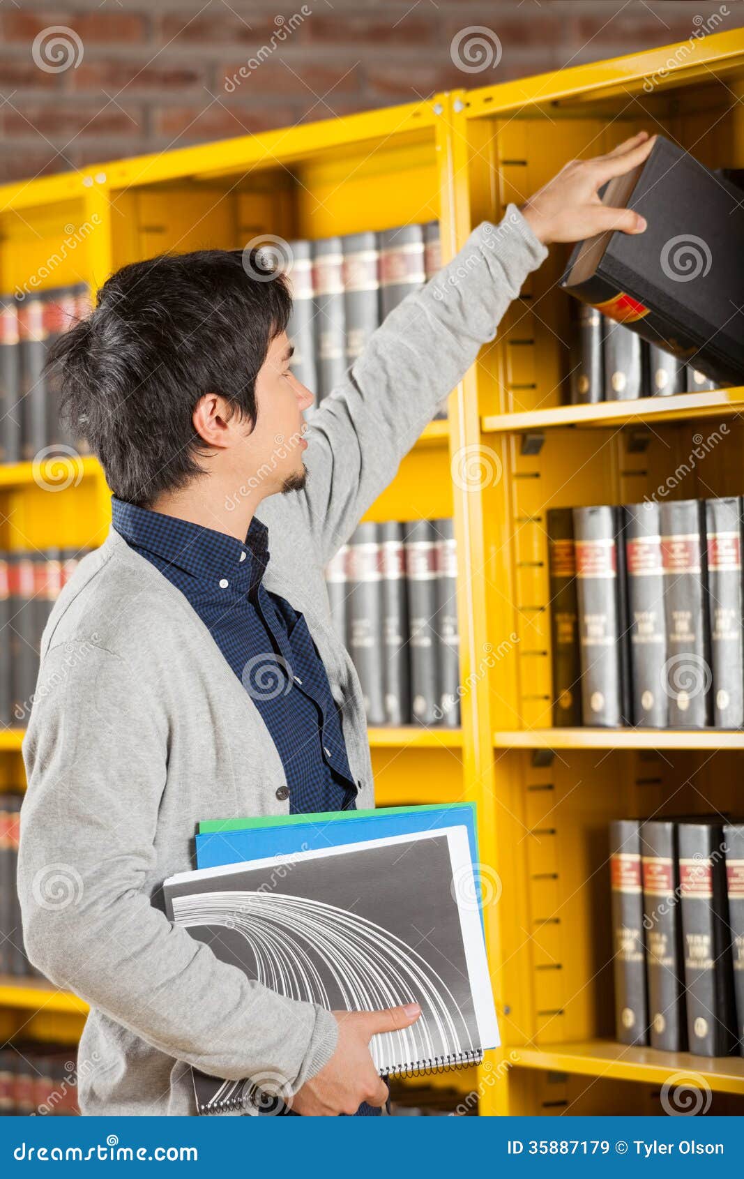 Student Taking Book from Shelf in University Stock Image - Image of ...