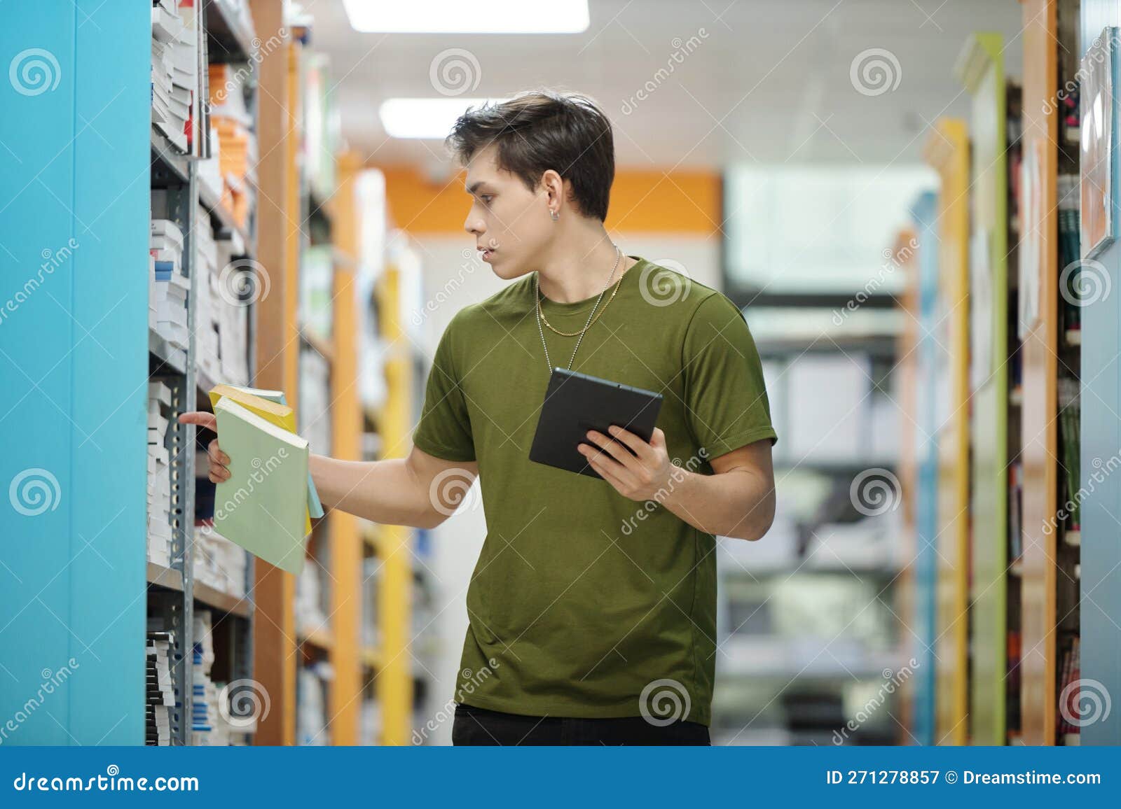 Student Taking Books from Shelves Stock Image - Image of reading ...