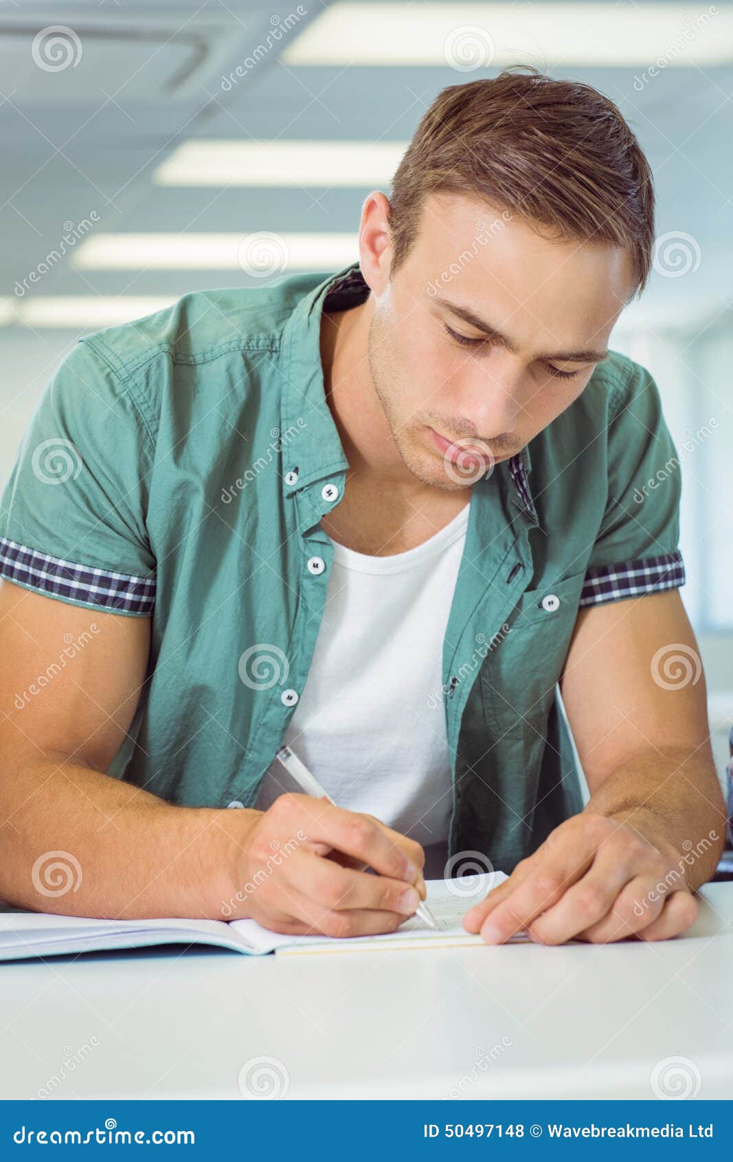 Student Taking Notes in Class Stock Photo - Image of assignment ...