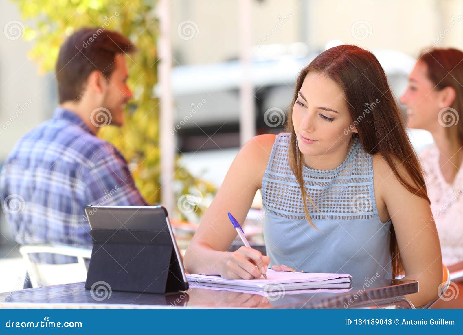 Student Taking Notes E-learning in a Bar Stock Image - Image of lesson ...