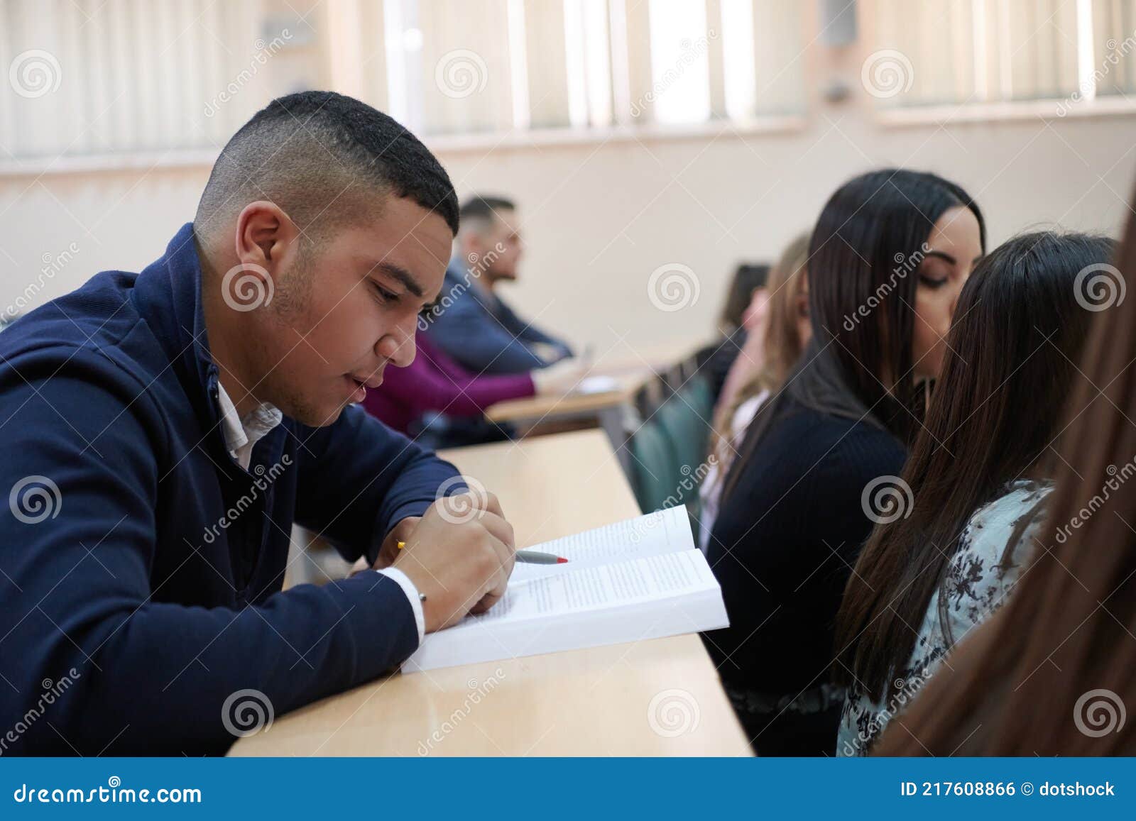 Student Taking Notes while Studying in High School Stock Photo - Image ...