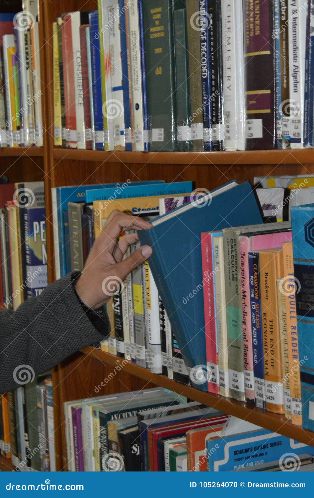 Student Taking Out Book from Shelf in Library Editorial Image - Image ...