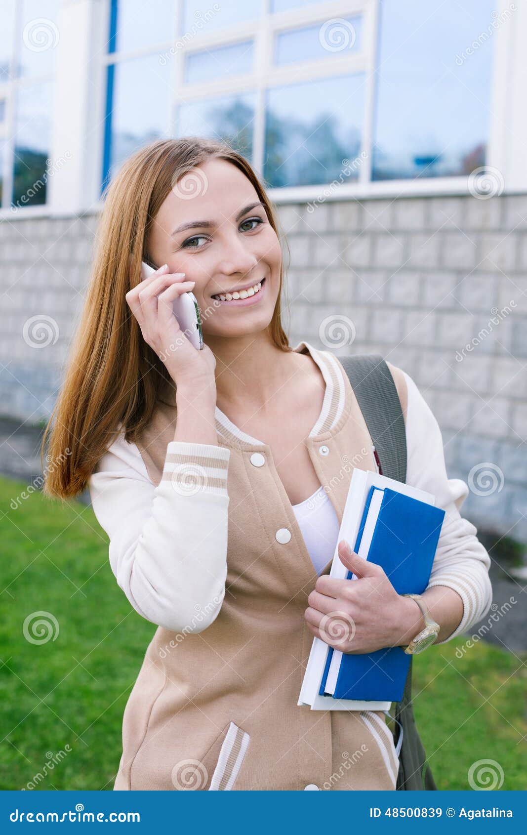 Student Talking on Phone and Looking at Camera Stock Image - Image of ...