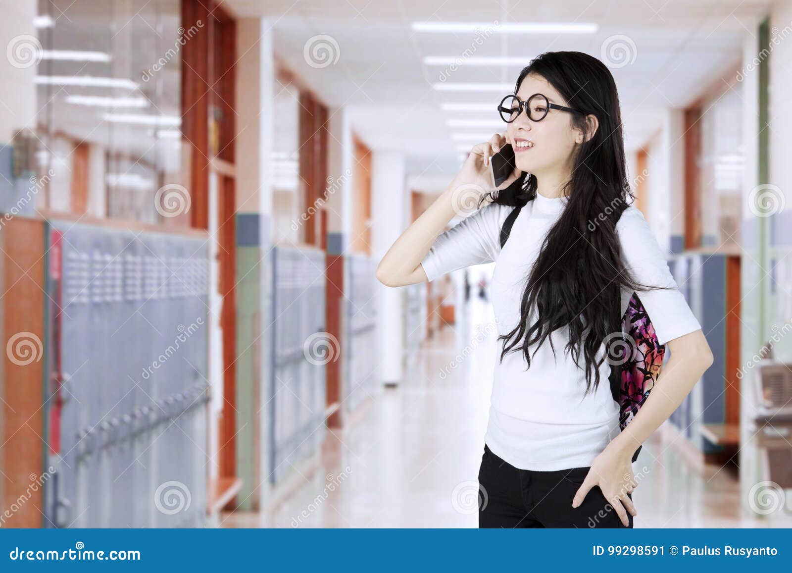 Student Talking on Smartphone in School Corridor Stock Image - Image of ...