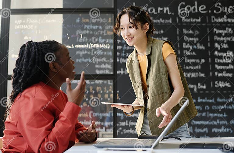 Student Talking To Teacher in the Classroom Stock Photo - Image of ...