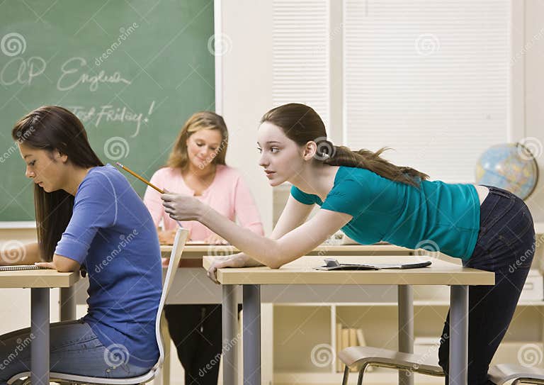 Student Tapping Classmate in Classroom Stock Photo - Image of school ...