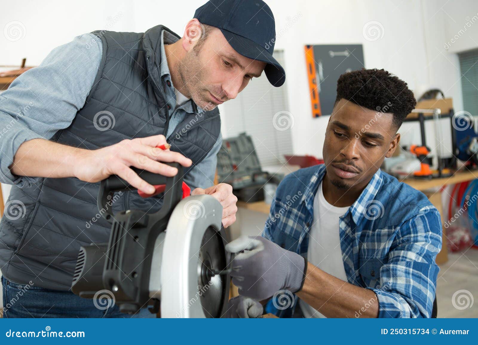 Student and Teacher in Carpentry Class Using Circular Saw Stock Photo ...