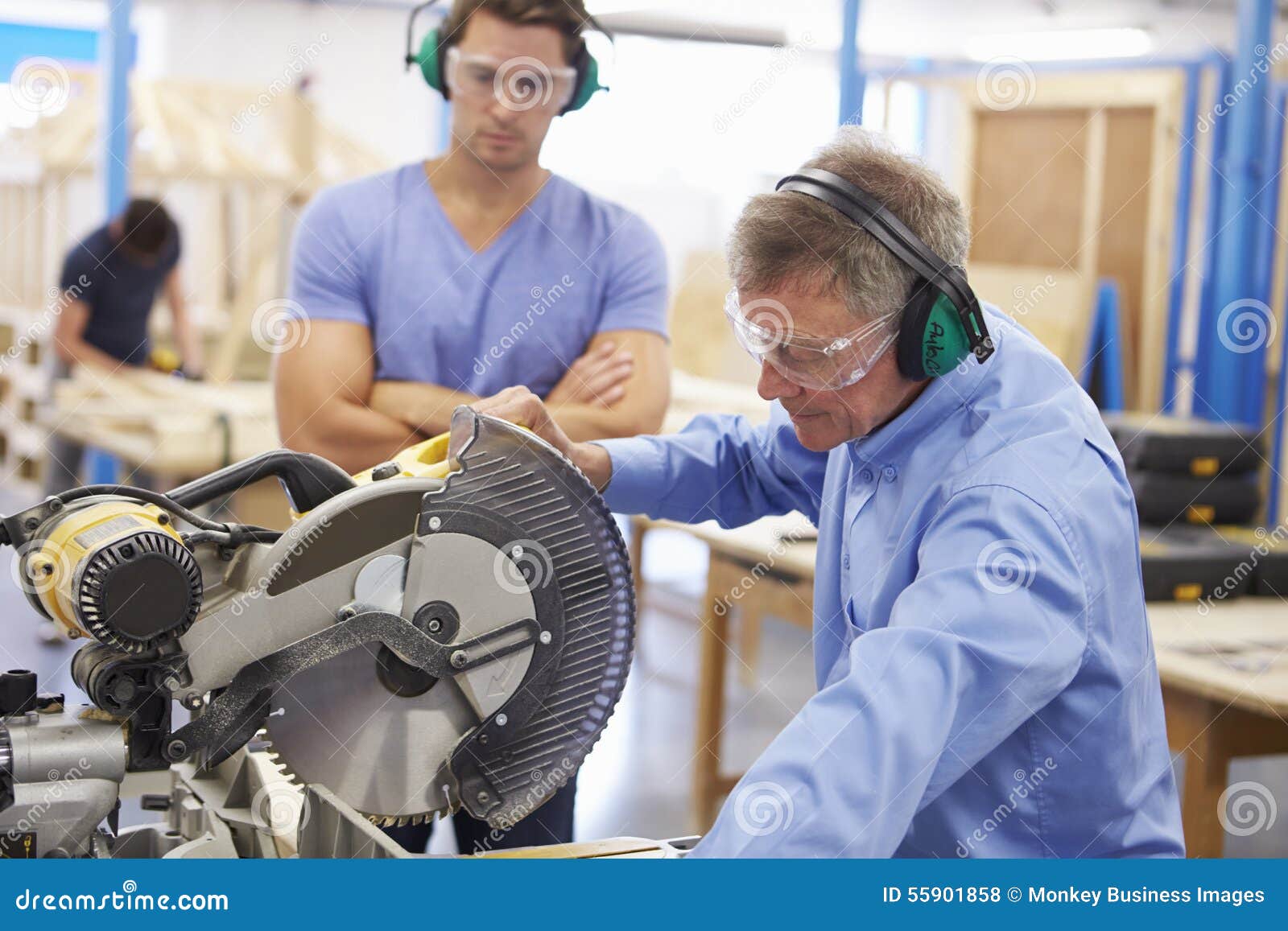 Student and Teacher in Carpentry Class Using Circular Saw Stock Photo ...