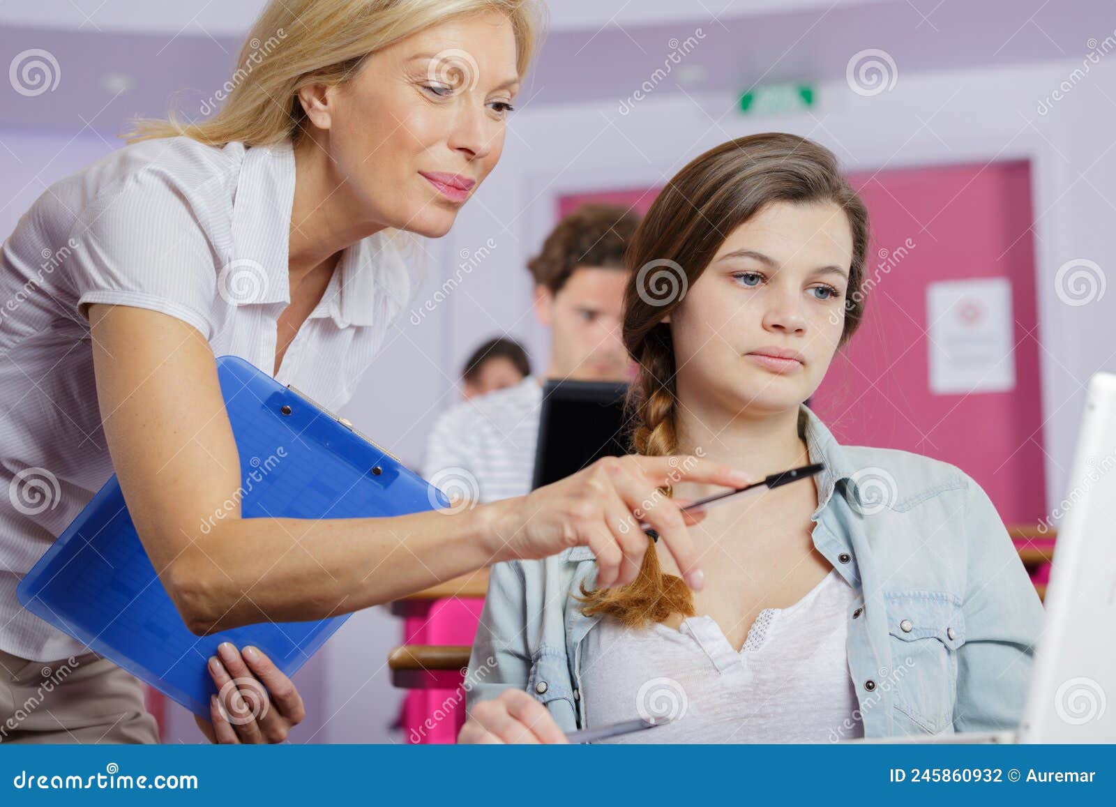 Student and Teacher Checking Something in Computer Stock Photo - Image ...