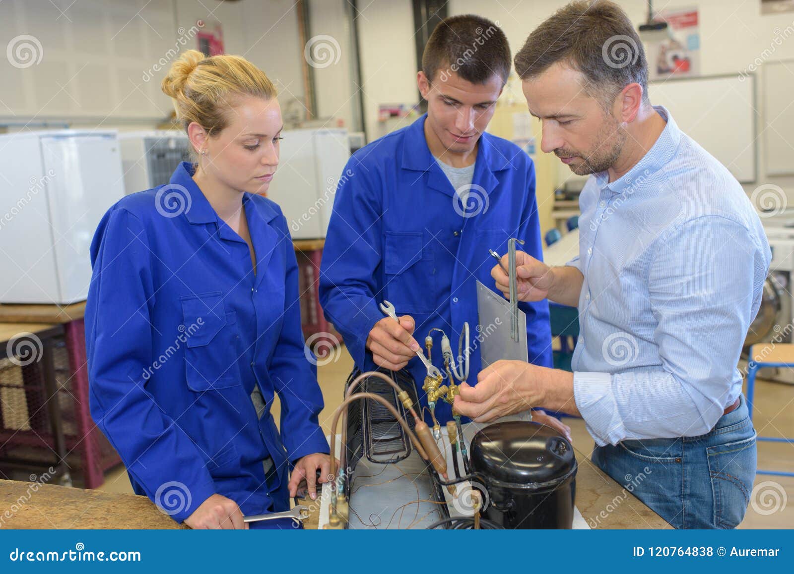 Student with Teacher Using Spanner Stock Photo - Image of student ...
