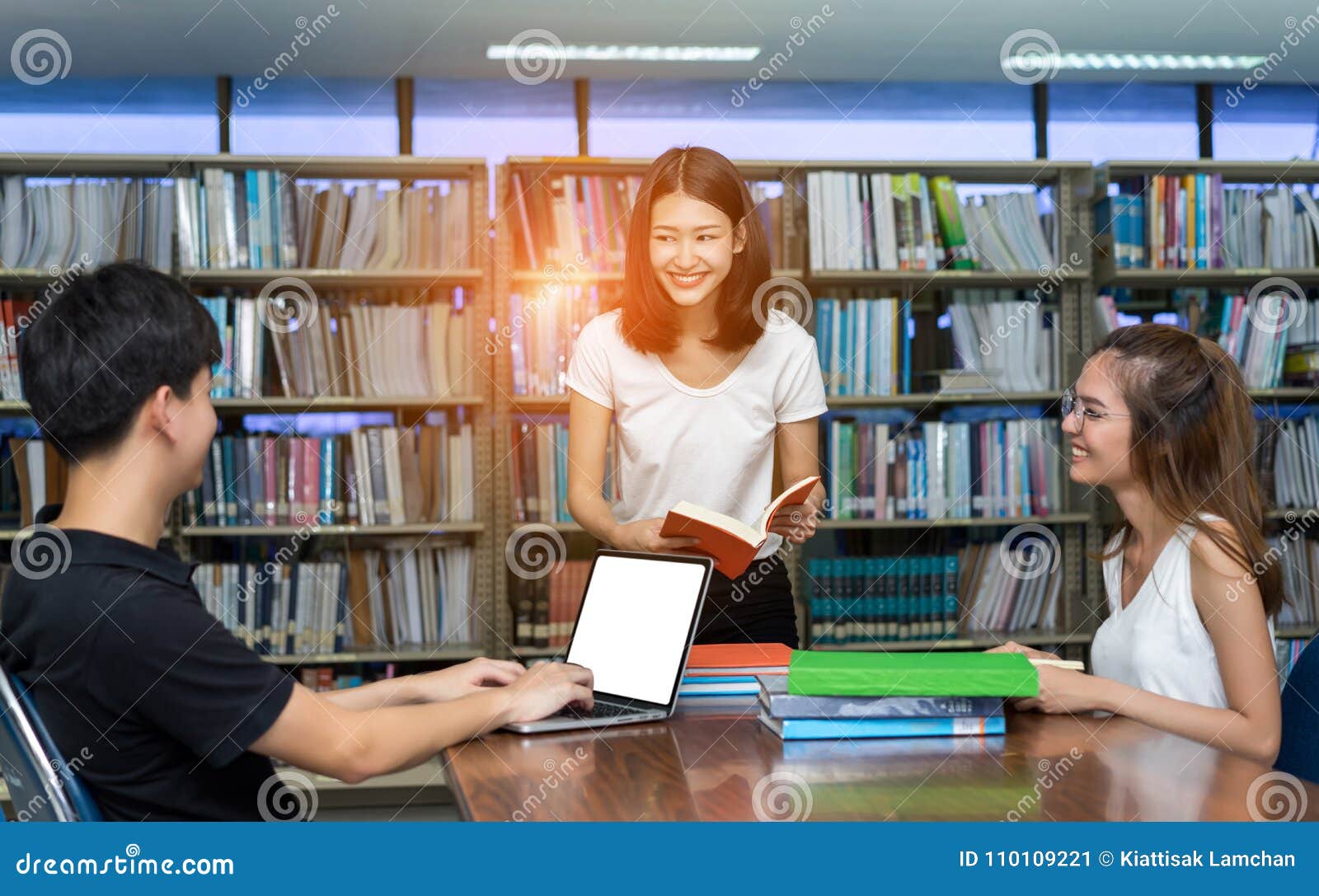 Student Teenage Talking, Reading Book, Using Laptop Computer Stock ...