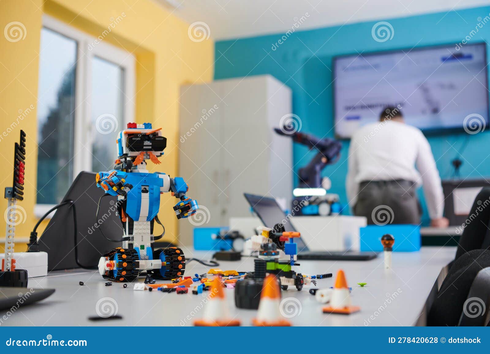 A Student Testing His New Invention of a Robotic Arm in the Laboratory ...