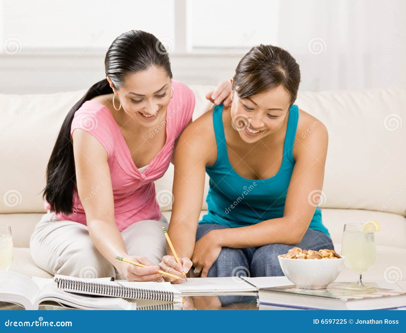 Student with Text Books Helping Friend Do Homework Stock Image - Image ...