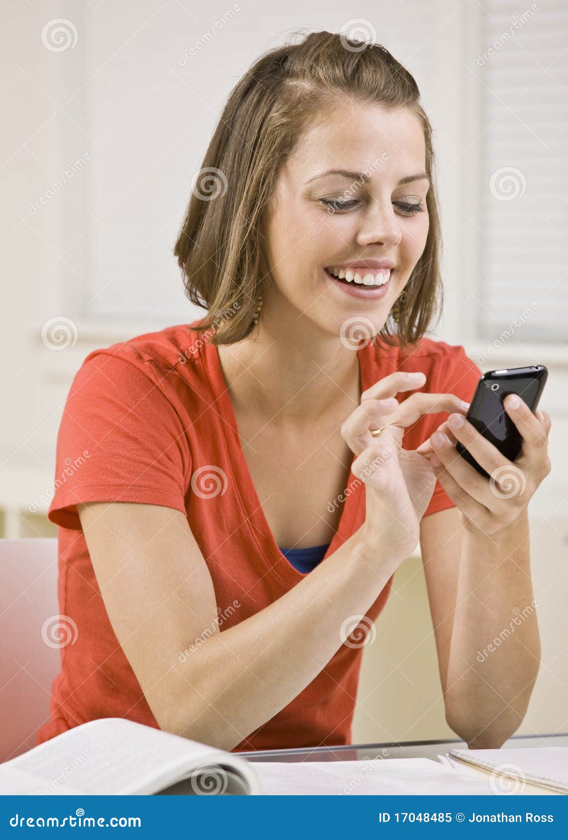 Student Text Messaging on Cell Phone in Classroom Stock Image - Image ...