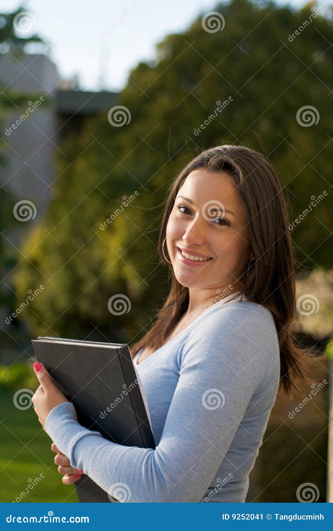 Student with Textbook on Campus Stock Image - Image of education, smile ...
