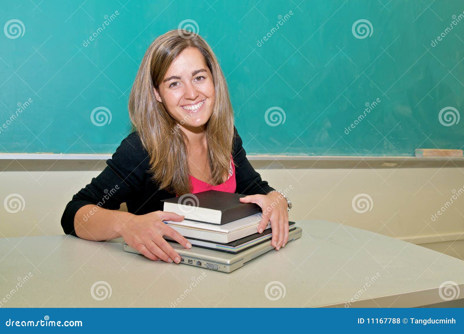 Student with Textbook in Classroom Stock Photo - Image of book ...