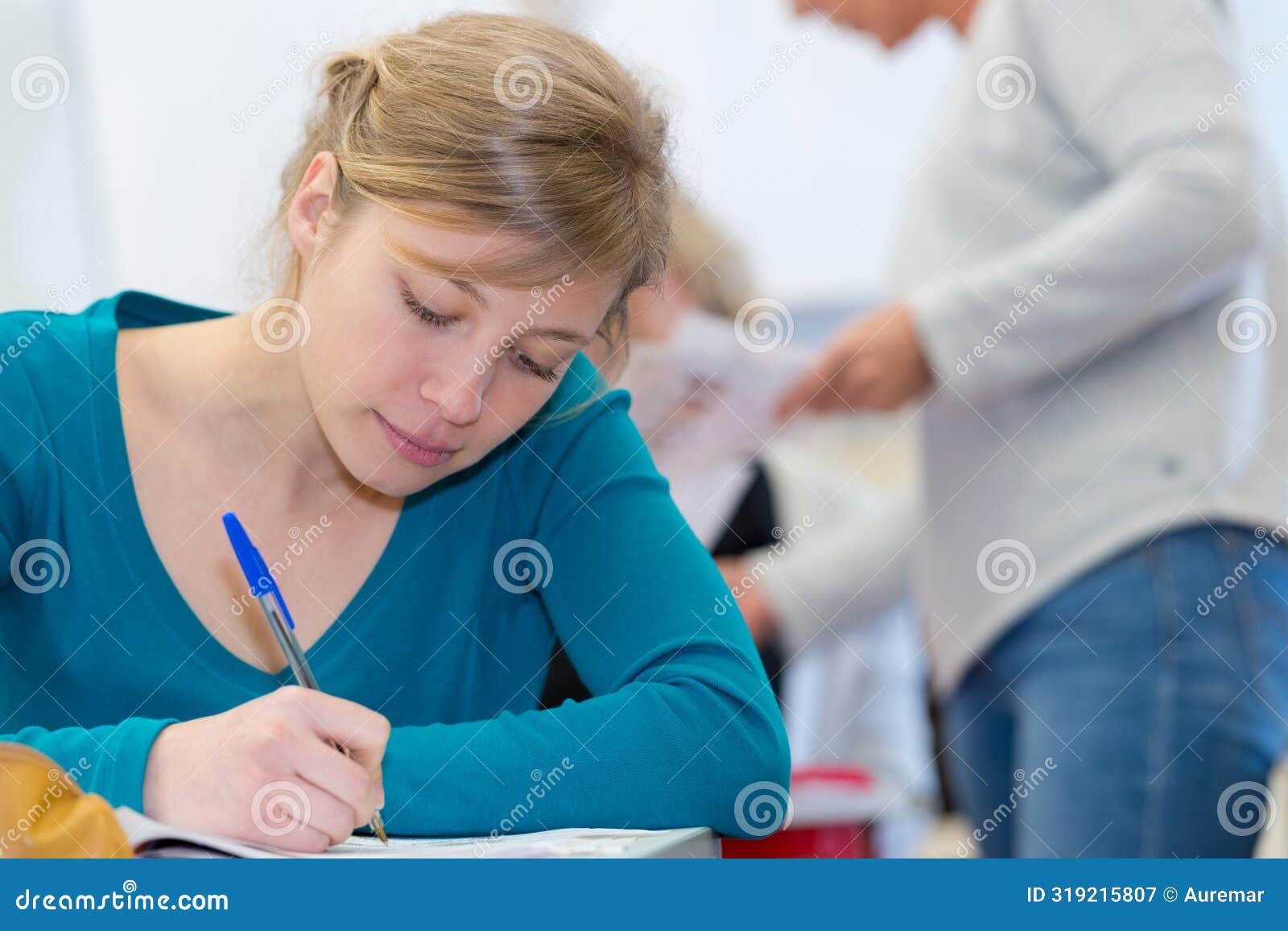 Student Trying To Do Difficult Exam in Classroom Stock Image - Image of ...