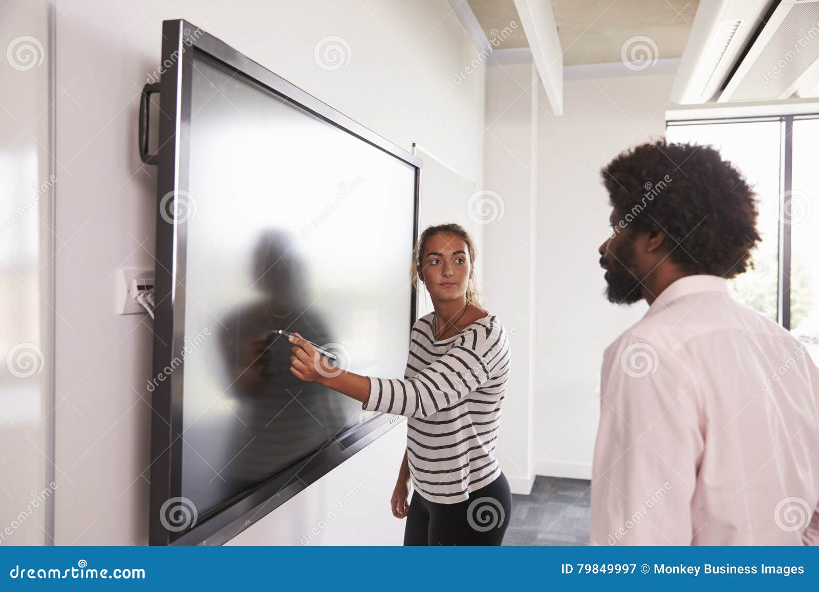 Student and Tutor Discuss Project on Interactive Whiteboard Stock Image ...