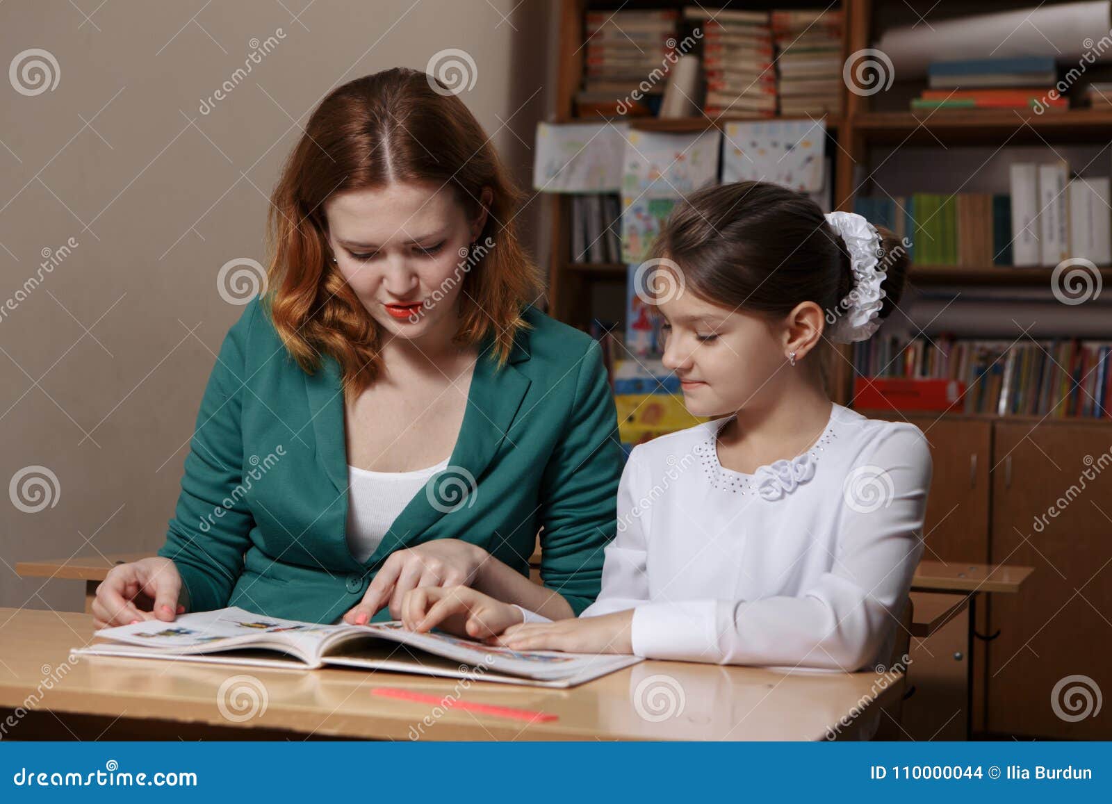 Student is Tutoring an Elementary School Stock Photo - Image of ...