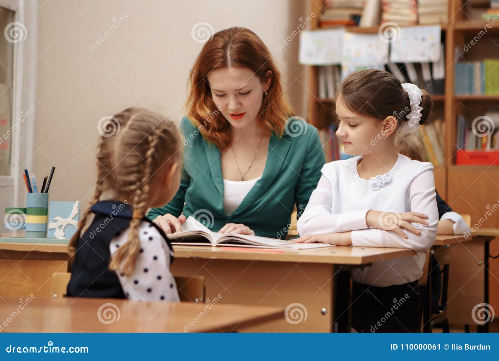 Student is Tutoring an Elementary School Stock Image - Image of people ...