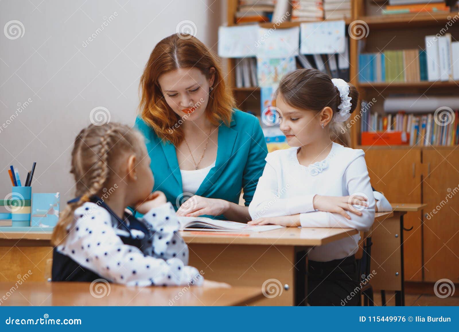 Student is Tutoring an Elementary School Stock Photo - Image of ...