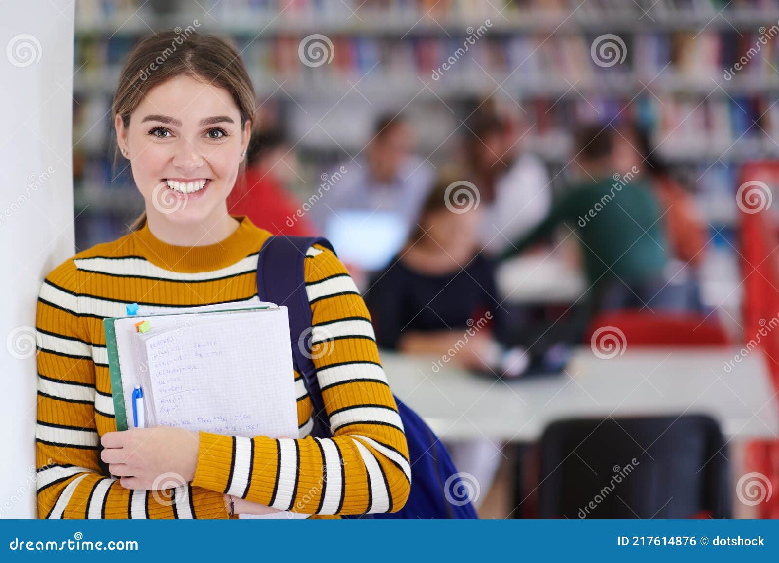 The Student Uses a Notebook and a School Library Stock Photo - Image of ...